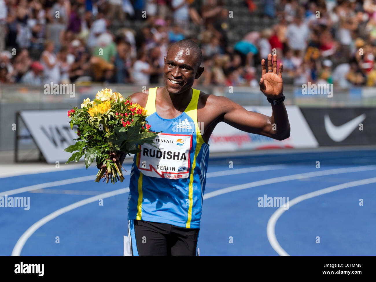 Kenyan athlete, David Lekuta Rudisha, running a lap of honour after ...