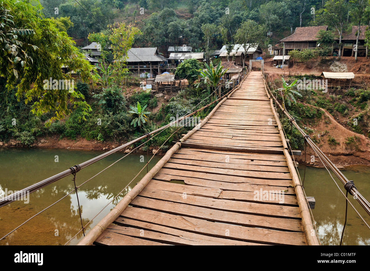 Suspension bridge leading to a village, Mai Chau valley, Northern ...