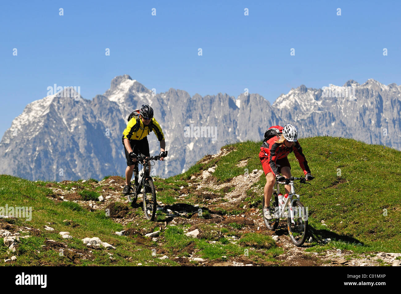 Mountain bikers on the Eggenalm alpine pasture in front of the Wilder ...
