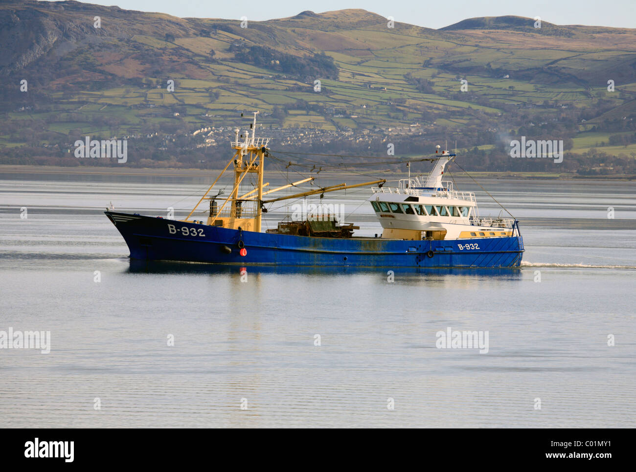 Mussel Dredger Mare Gratia on the Menai Strait with the foothills of ...