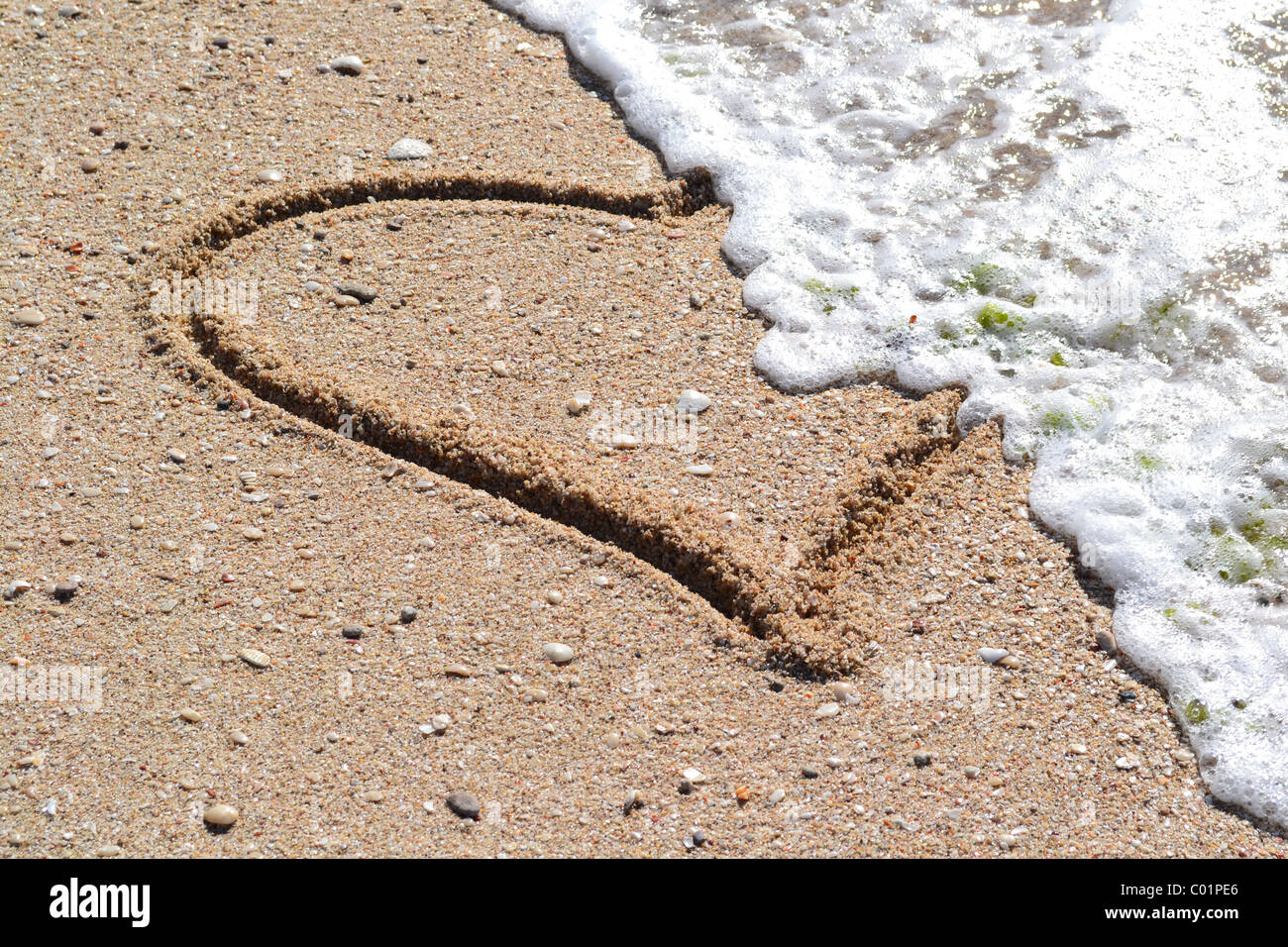 Tide Erasing Valentine Heart On Beach Stock Photo - Alamy