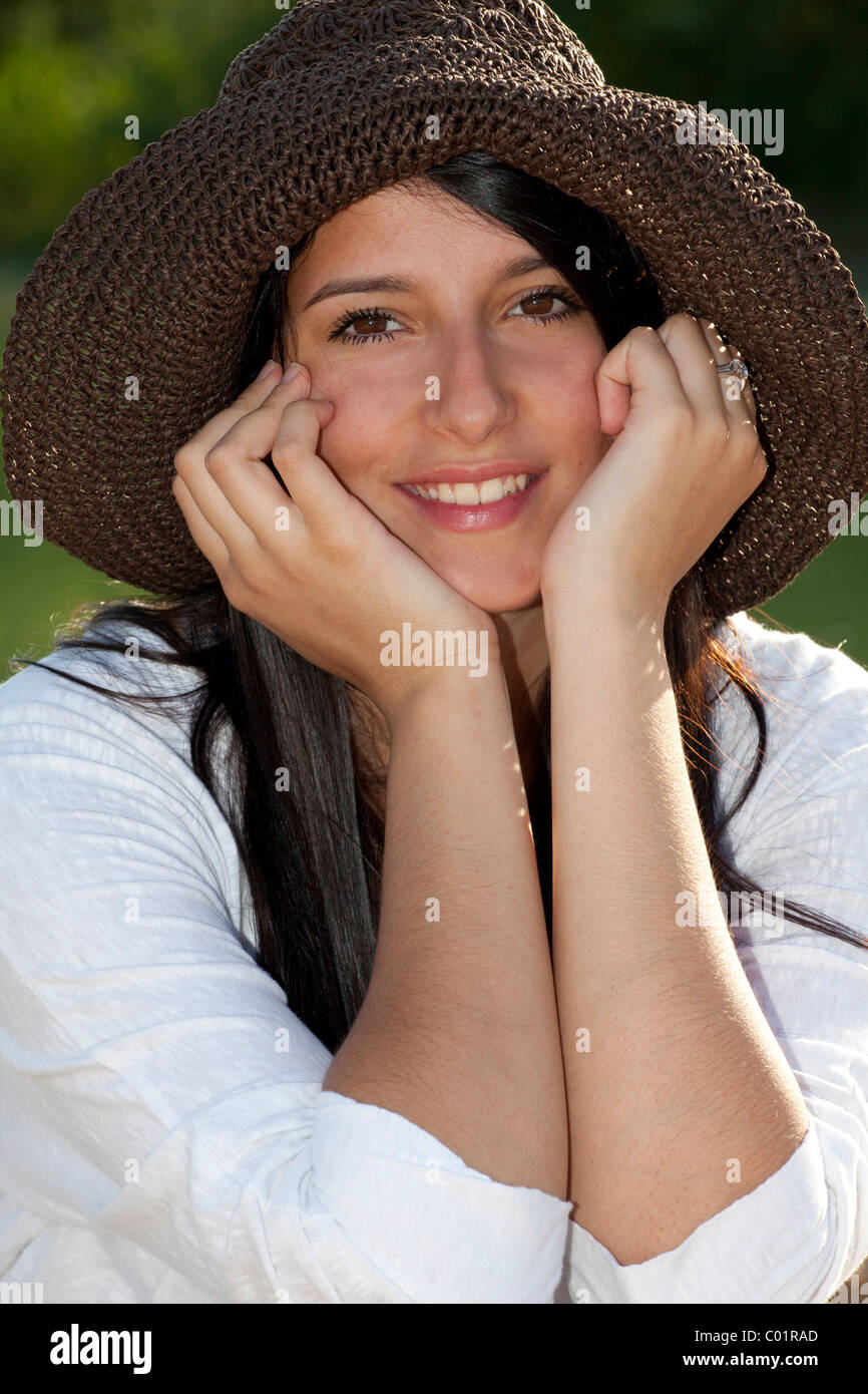 Young woman wearing a straw hat Stock Photo - Alamy