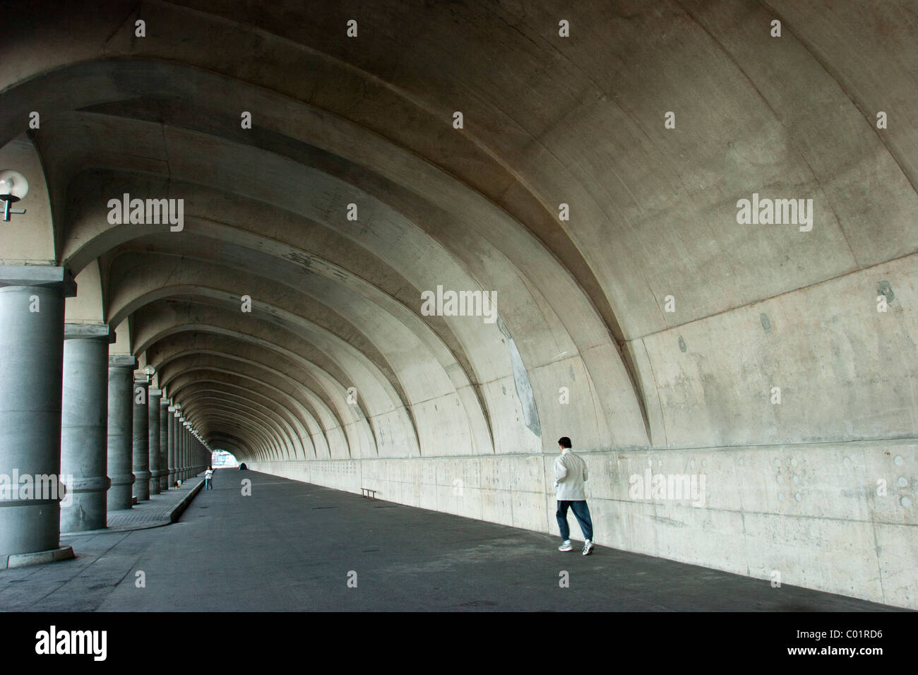 A jogger and a seawall/breakwater in Wakkanai, Hokkaido, Japan, June ...
