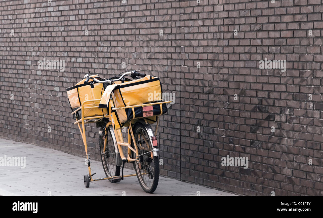 Postman's bicycle in front of a wall, Hamburg, Germany, Europe Stock ...