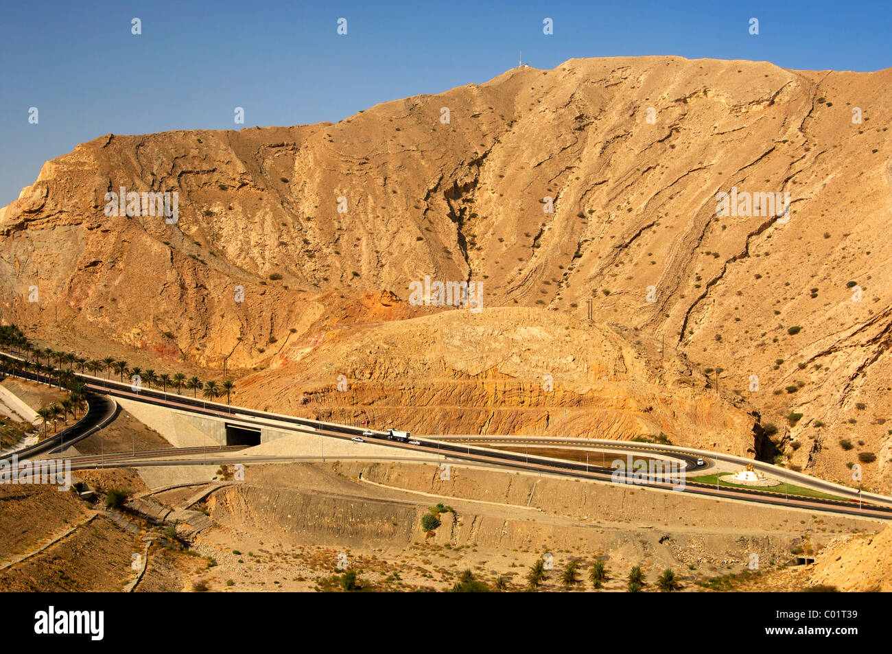 Modern highway in the barren mountains of Oman, Sultanate of Oman ...