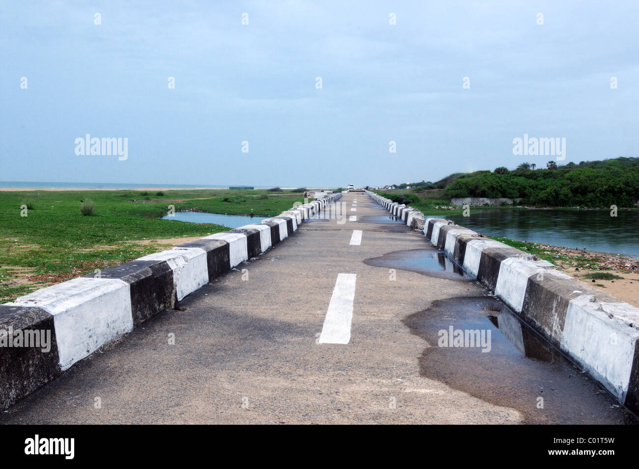 A road leading to water and country side Stock Photo - Alamy