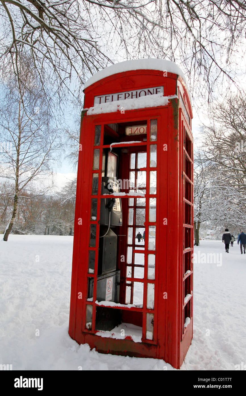 A snow covered red telephone box Stock Photo - Alamy