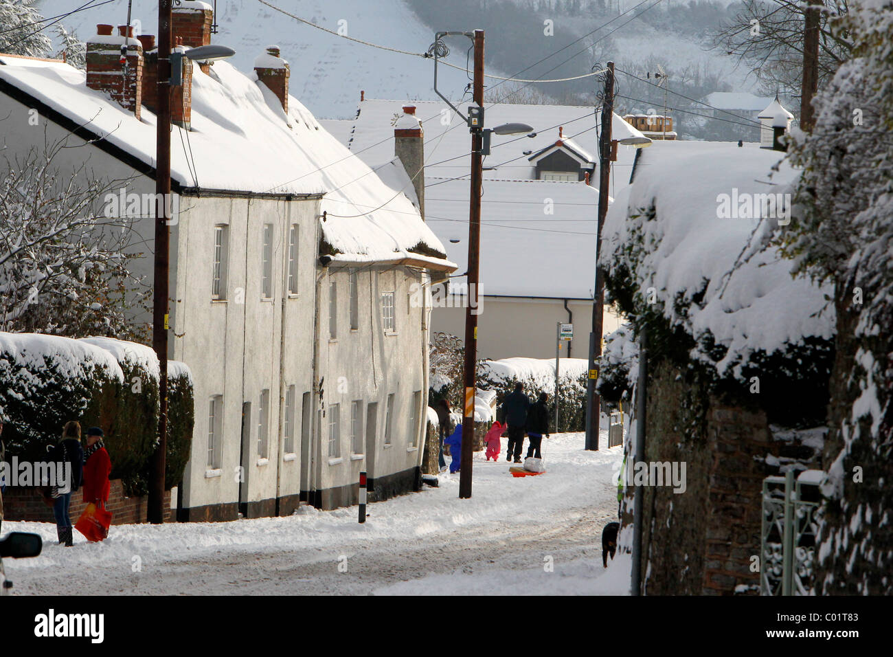 A snowy village street scene Stock Photo - Alamy