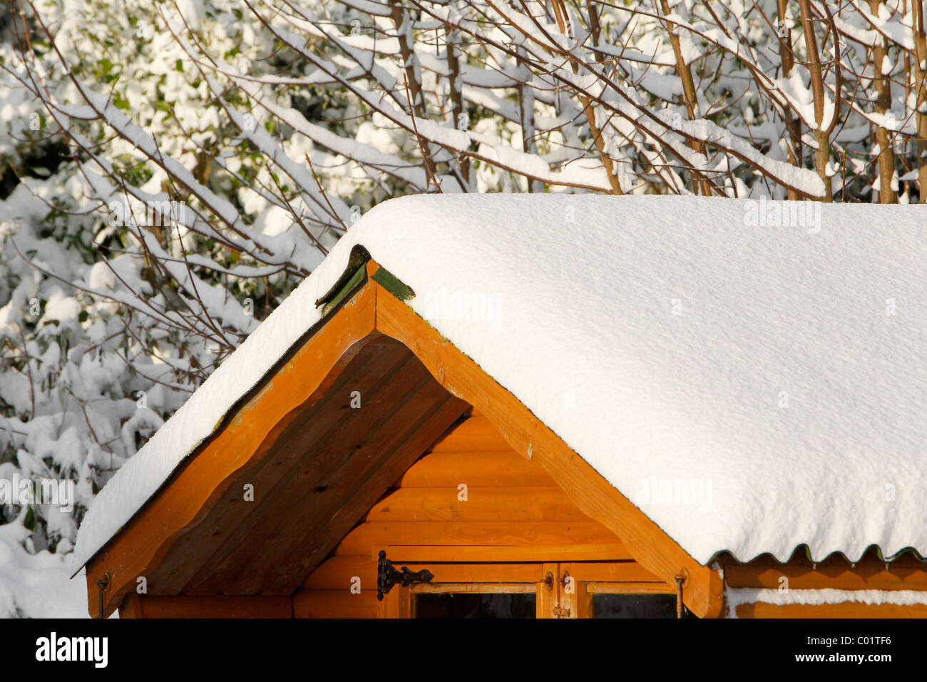 A snow covered shed roof Stock Photo - Alamy