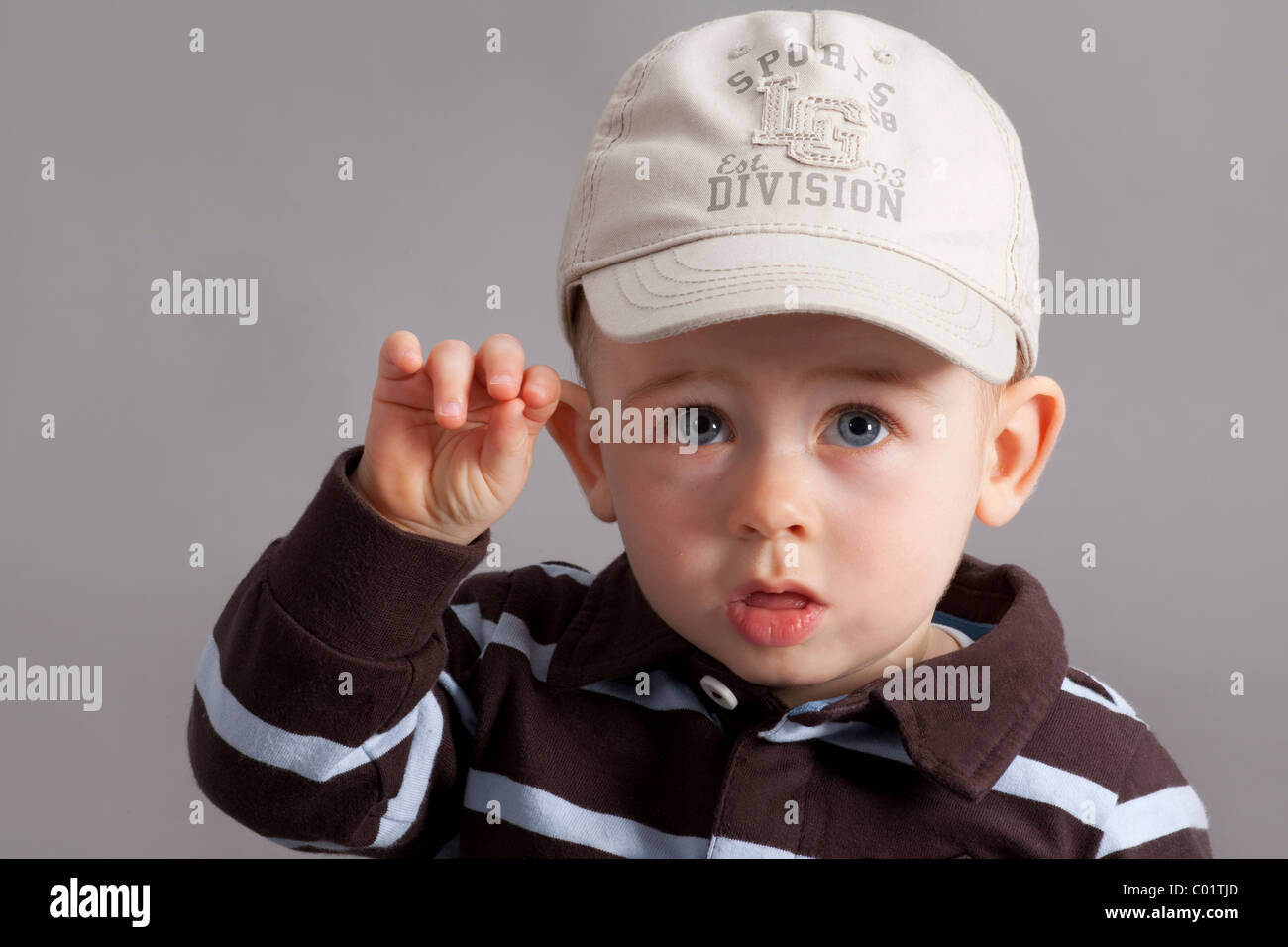 Baby with cap, boy, 8 months, portrait Stock Photo - Alamy