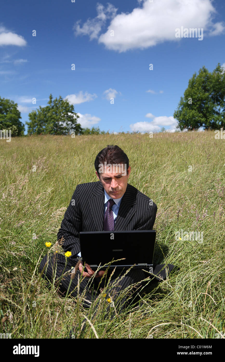 Businessman working remotely in rural location Stock Photo - Alamy