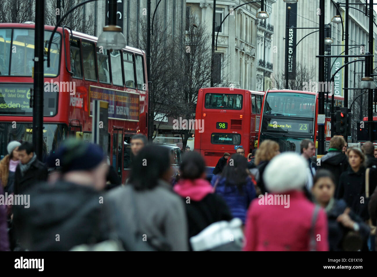 A busy Oxford street scene with people walking and buses moving Stock ...