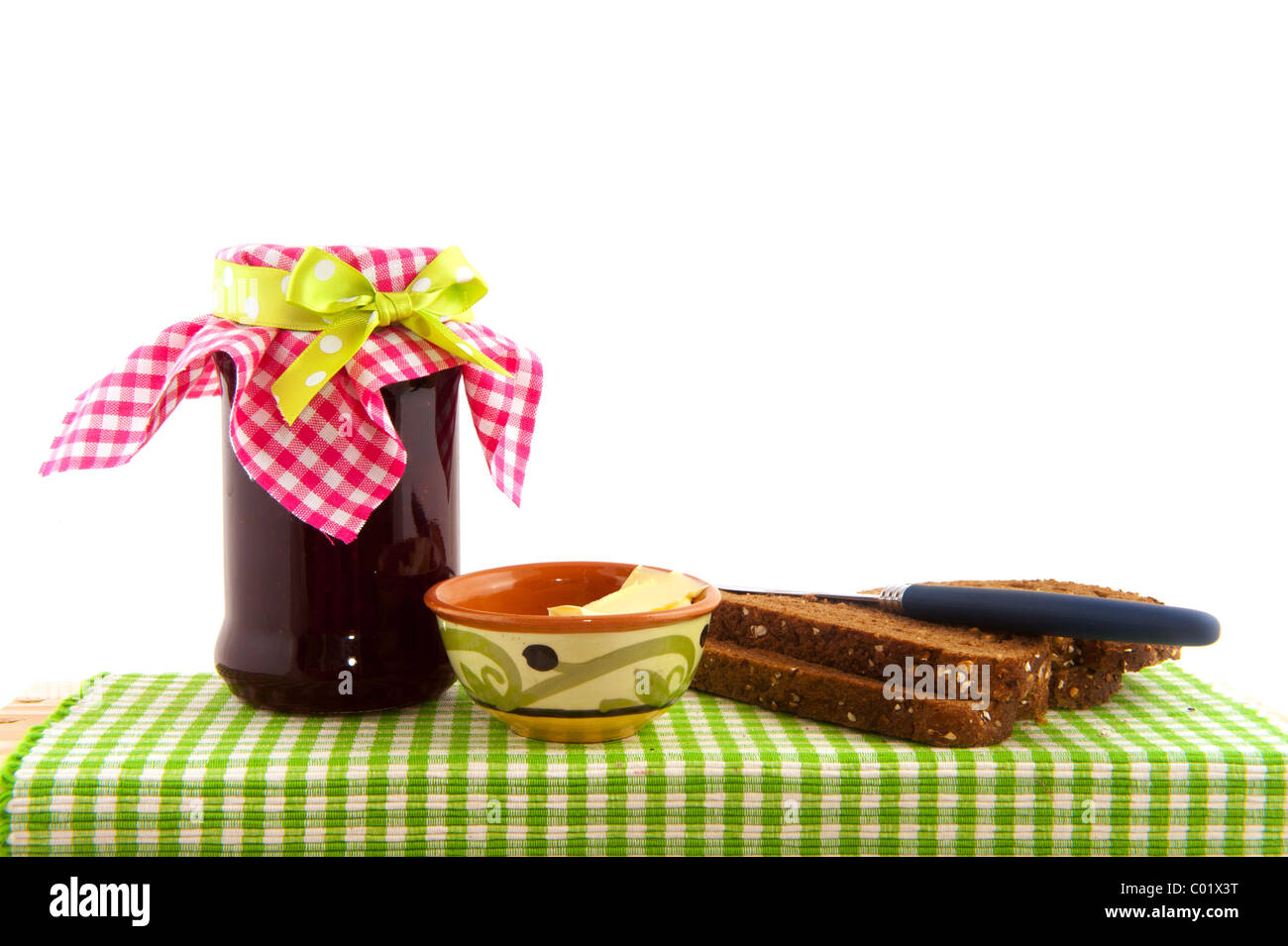 Making breakfast with preserved fruit jam bread and butter Stock Photo ...