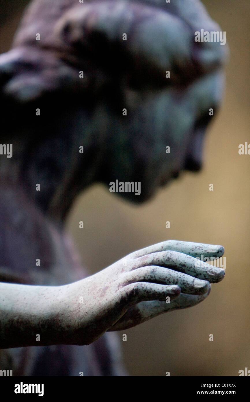 Hand of a cemetery statue Stock Photo - Alamy