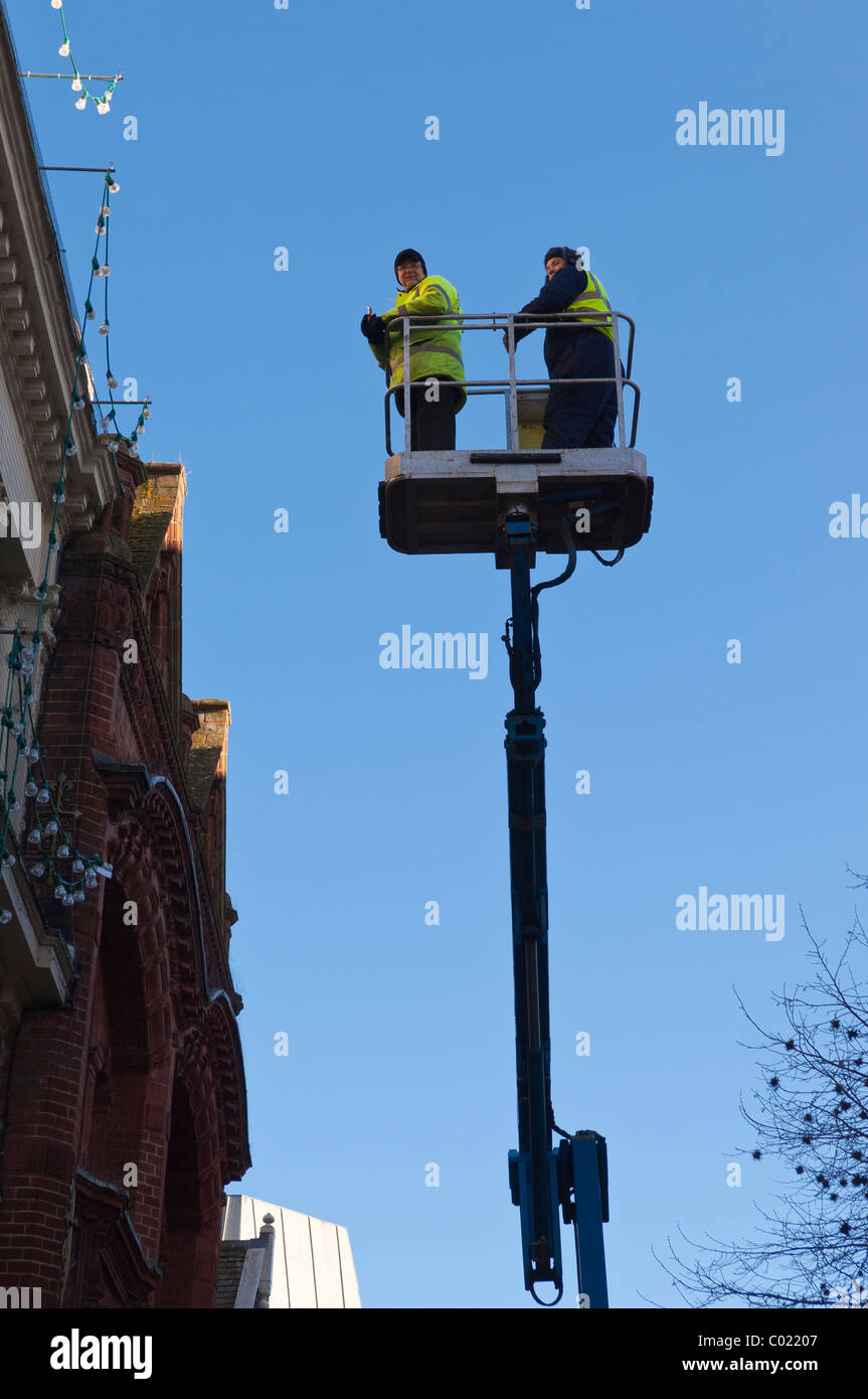 People up a cherry picker hi-res stock photography and images - Alamy