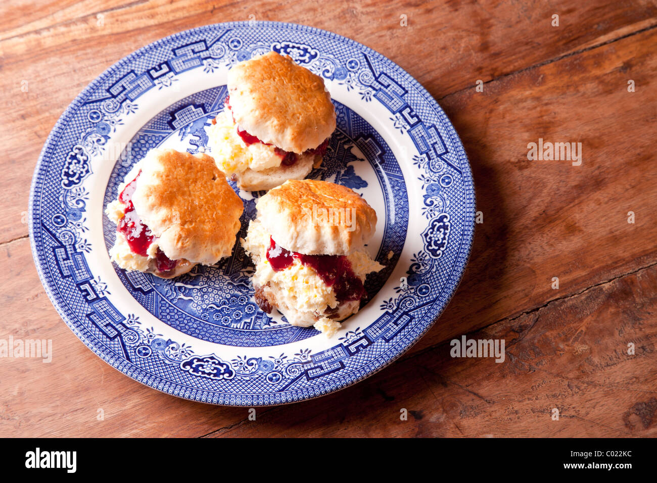 Plated three scones on the wooden table Stock Photo - Alamy