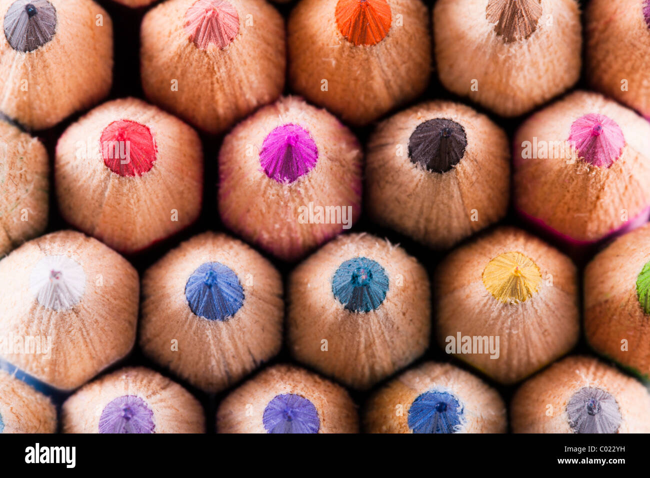 background of a stack colorfull colored pencils seen from above, small ...
