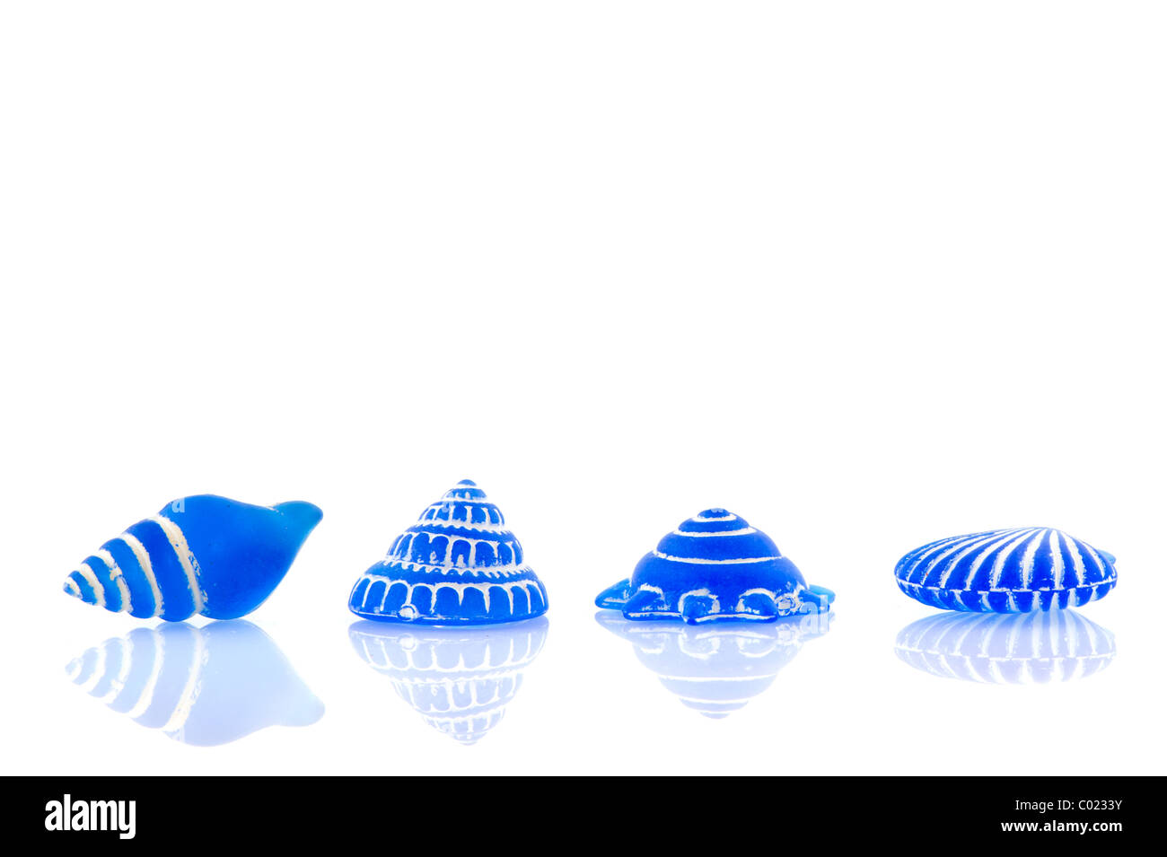 Several blue glass shells isolated over white Stock Photo - Alamy