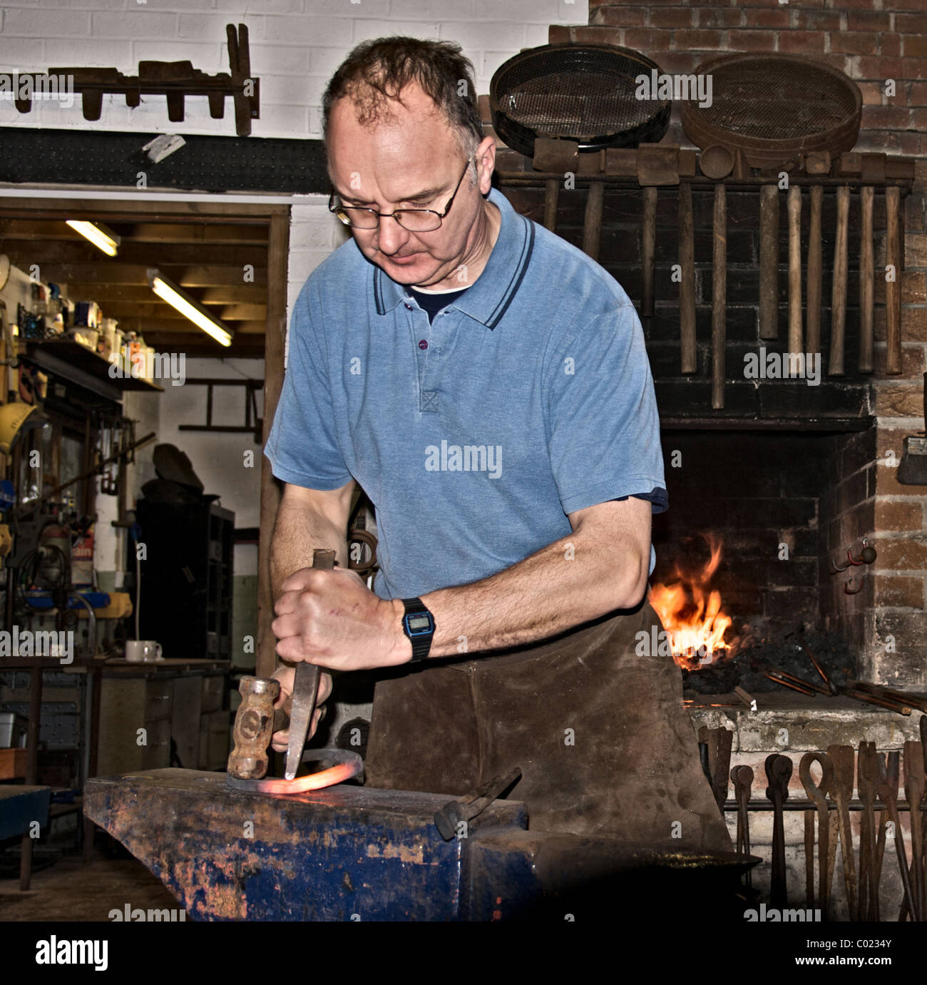 Blacksmith at work Stock Photo - Alamy