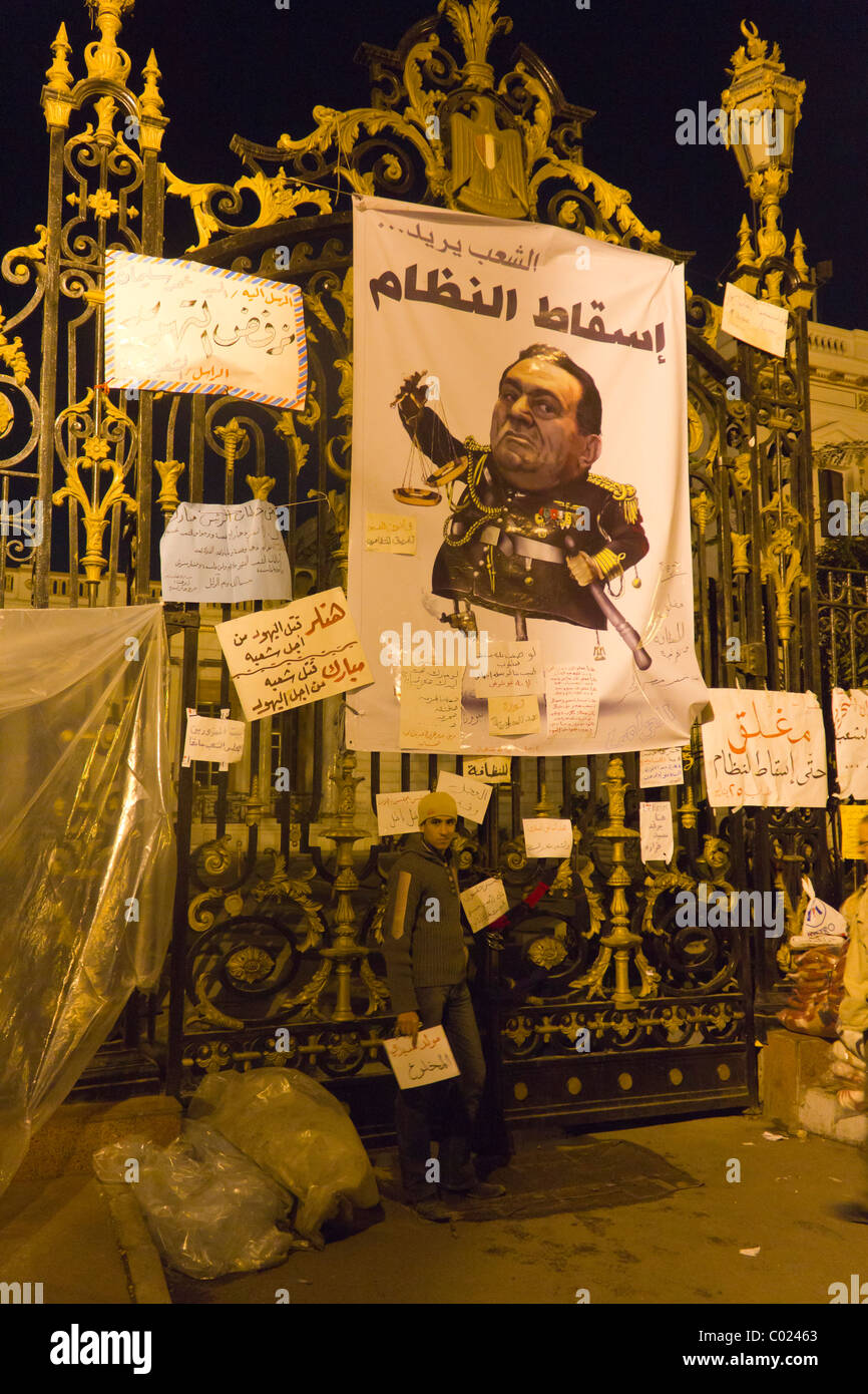 poster of Mubarak on parliament gate saying Abolish the Regime, Cairo ...