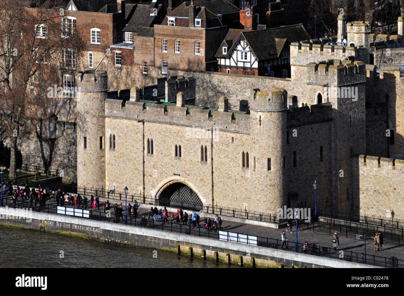 View looking down on tourists at historic castle buildings of Tower of ...