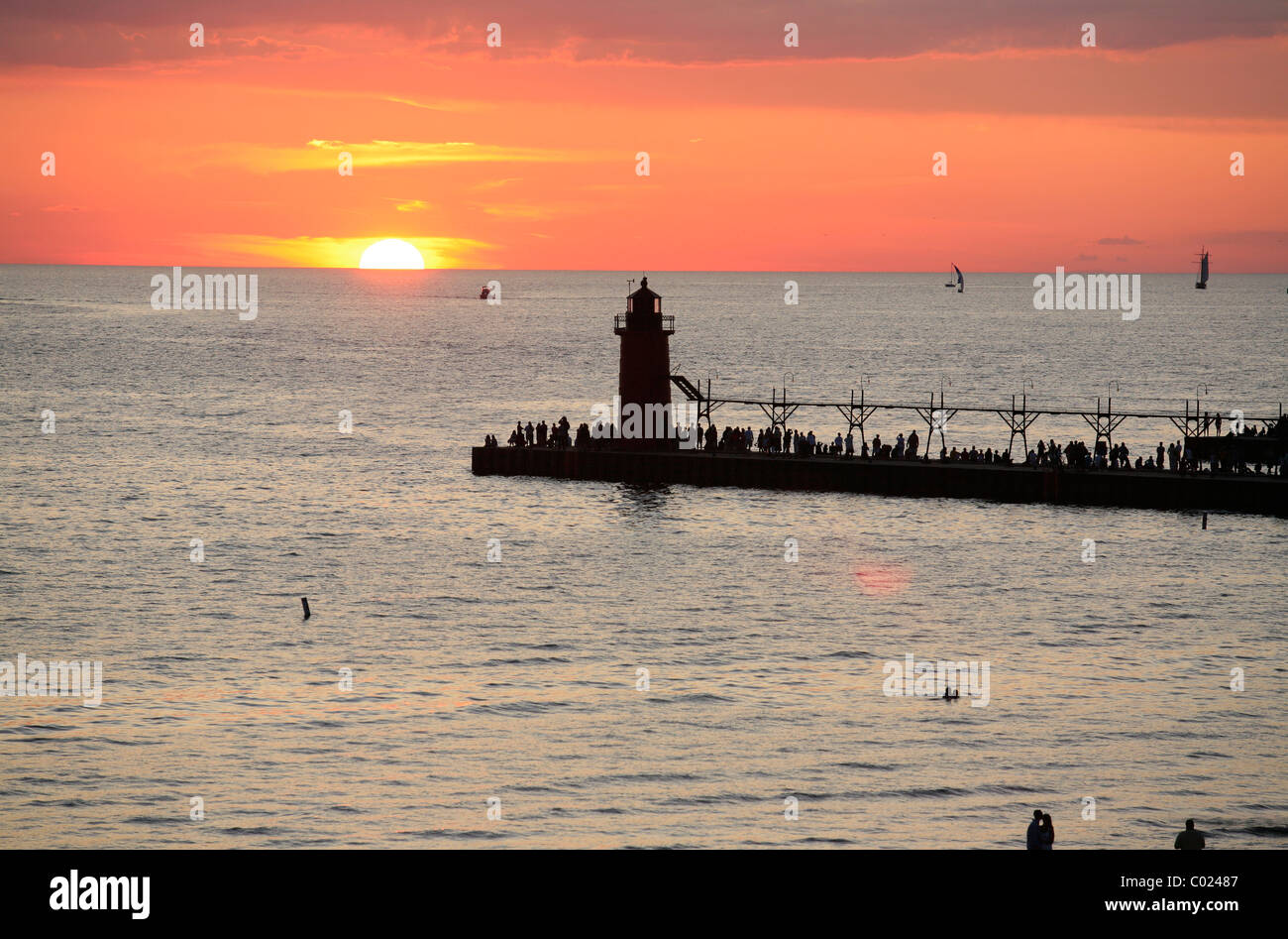 Sunset over lake Michigan with the lighthouse and south pier in South ...
