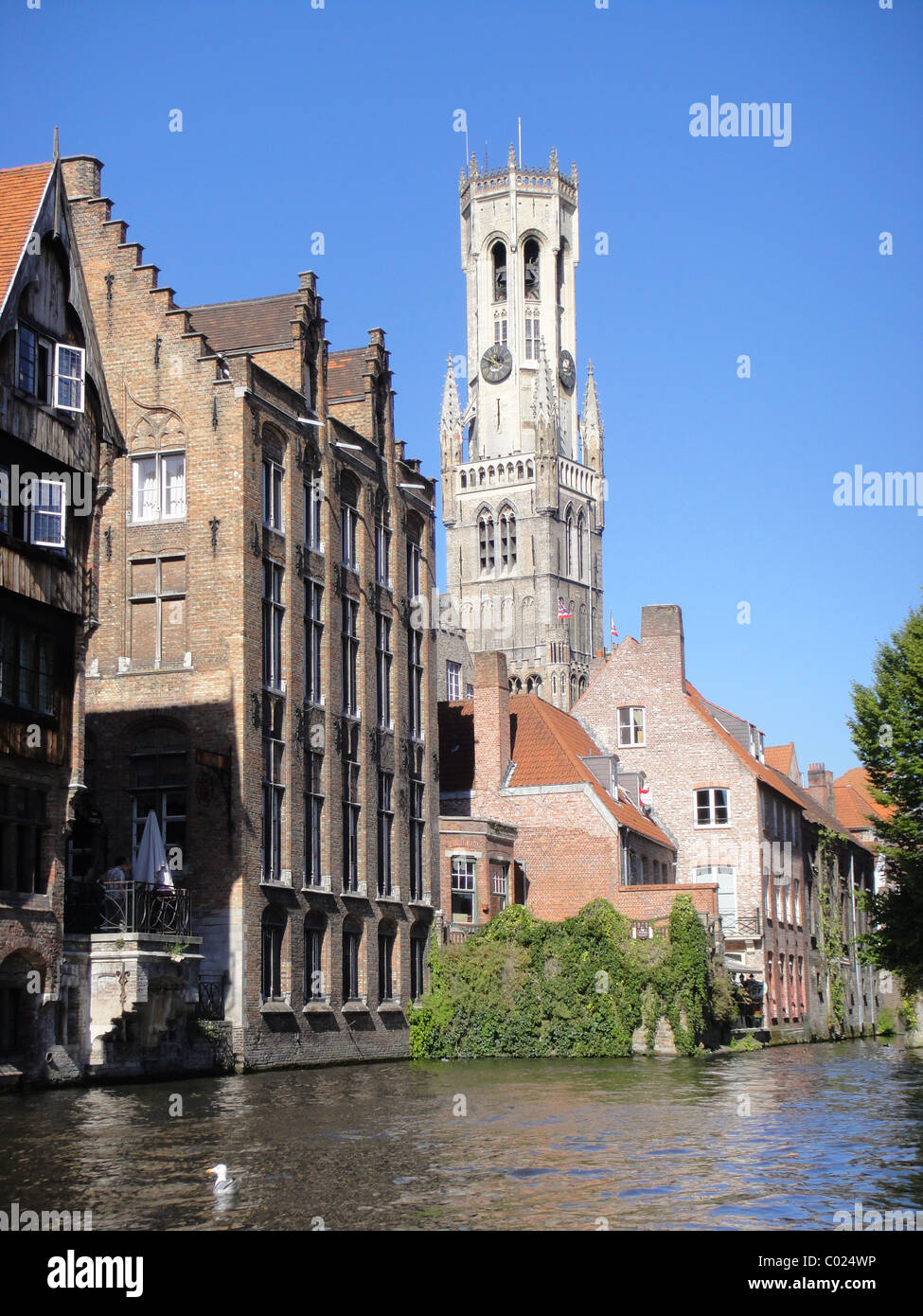 River Dijver at Bruges showing riverside buildings and The Belfry Stock ...