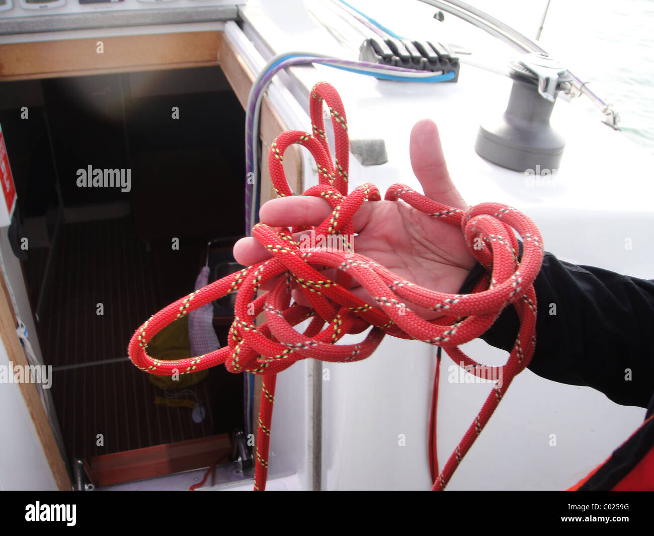 Tangled yacht rope Stock Photo - Alamy