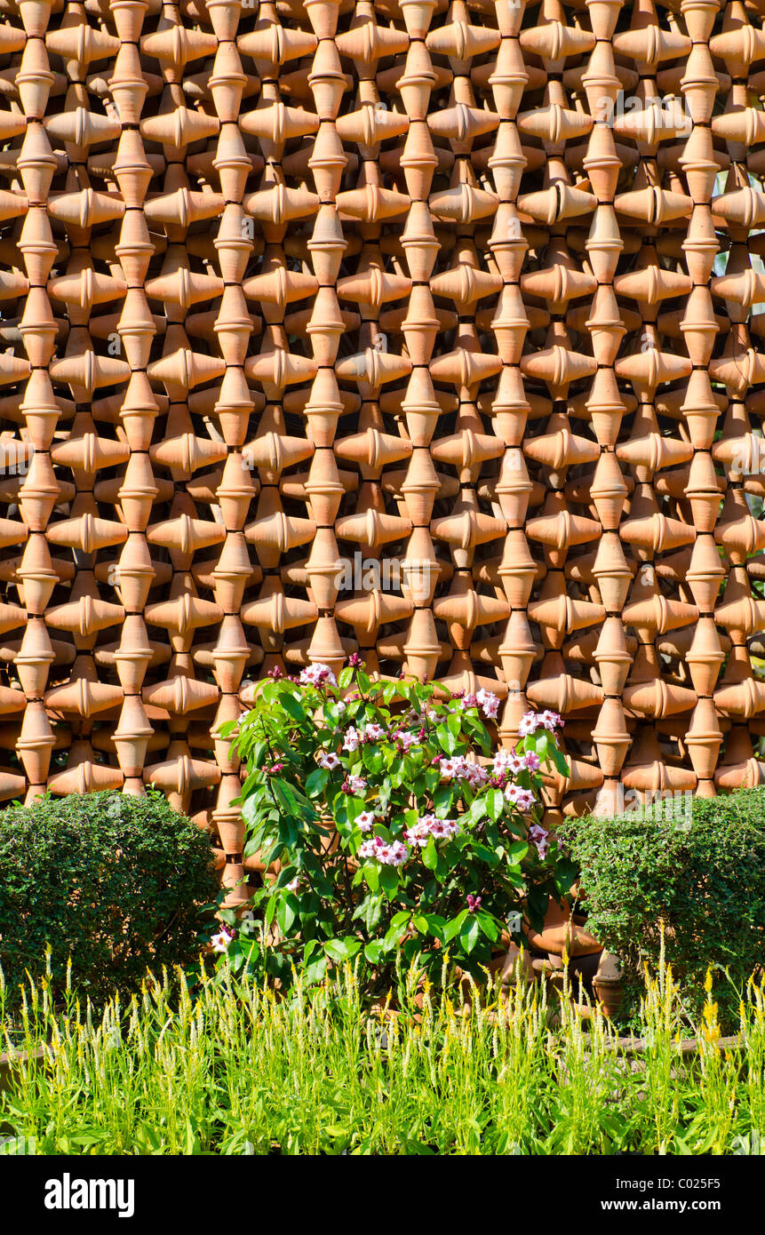 symmetrical plant-pot wall and garden Stock Photo - Alamy