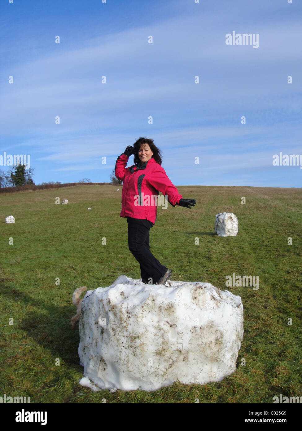 Woman posing on block of snow Stock Photo - Alamy