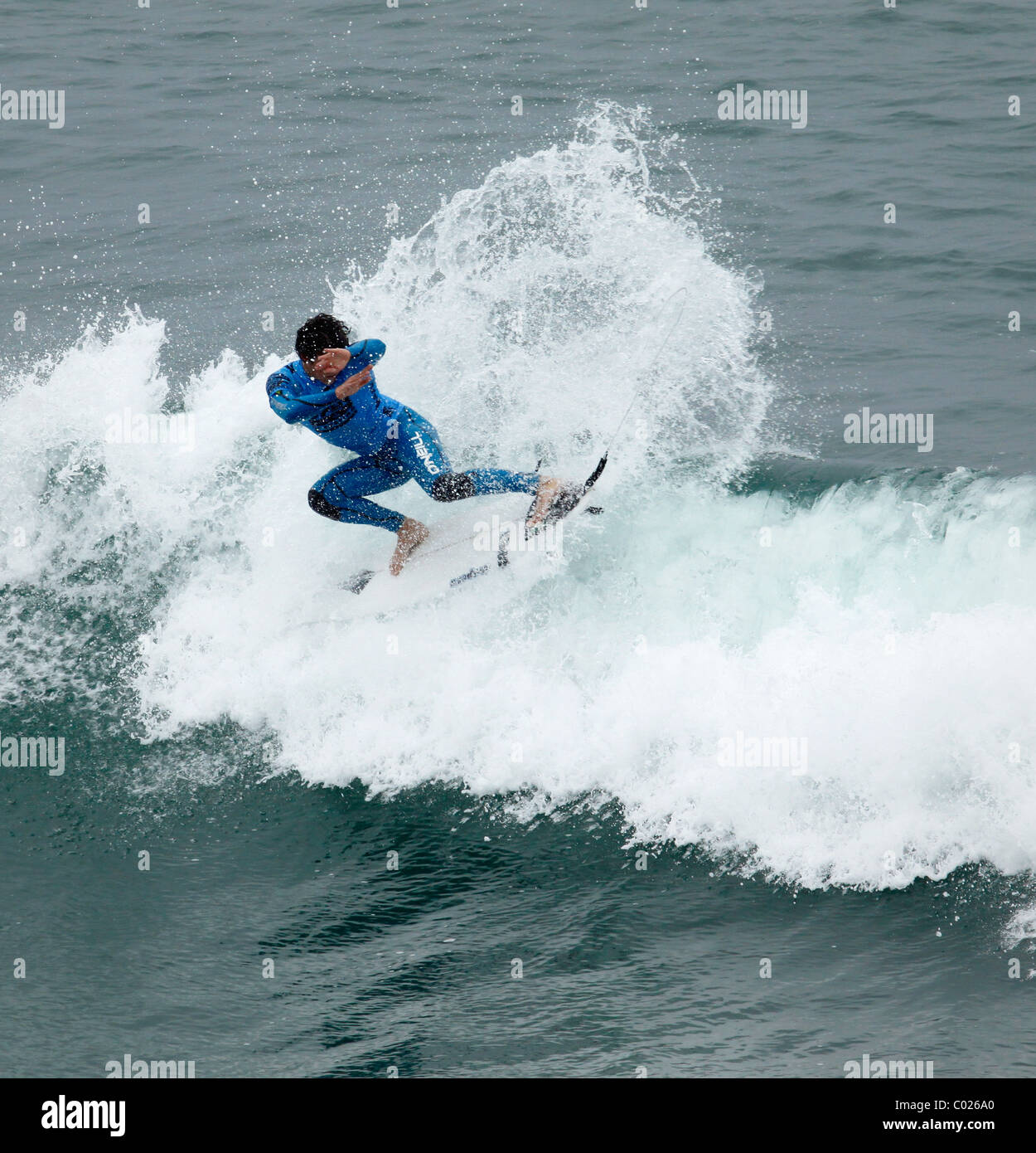 Pro surfer competing in the "US Open of Surfing" at Huntington Beach ...