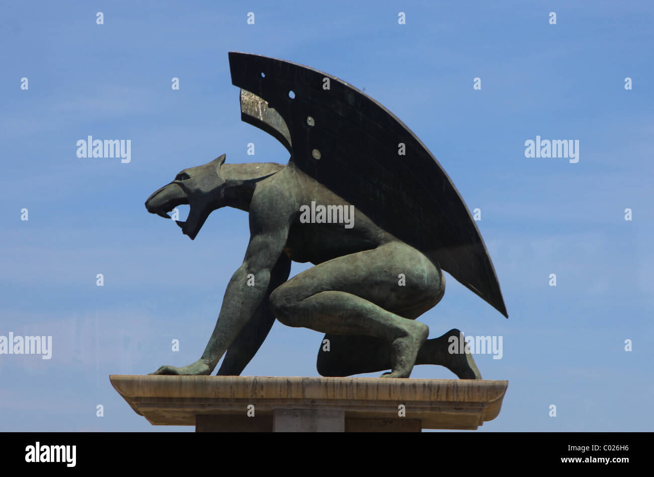 Sinister mythical winged statue on bridge in Valencia, Spain Stock ...