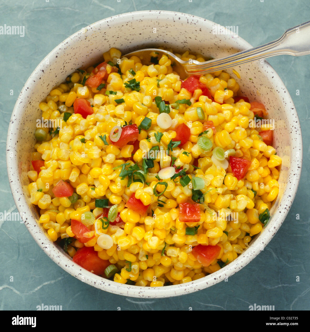 corn relish in bowl with spoon Stock Photo - Alamy