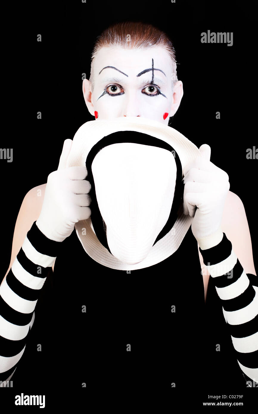 mime holding white hat Stock Photo - Alamy