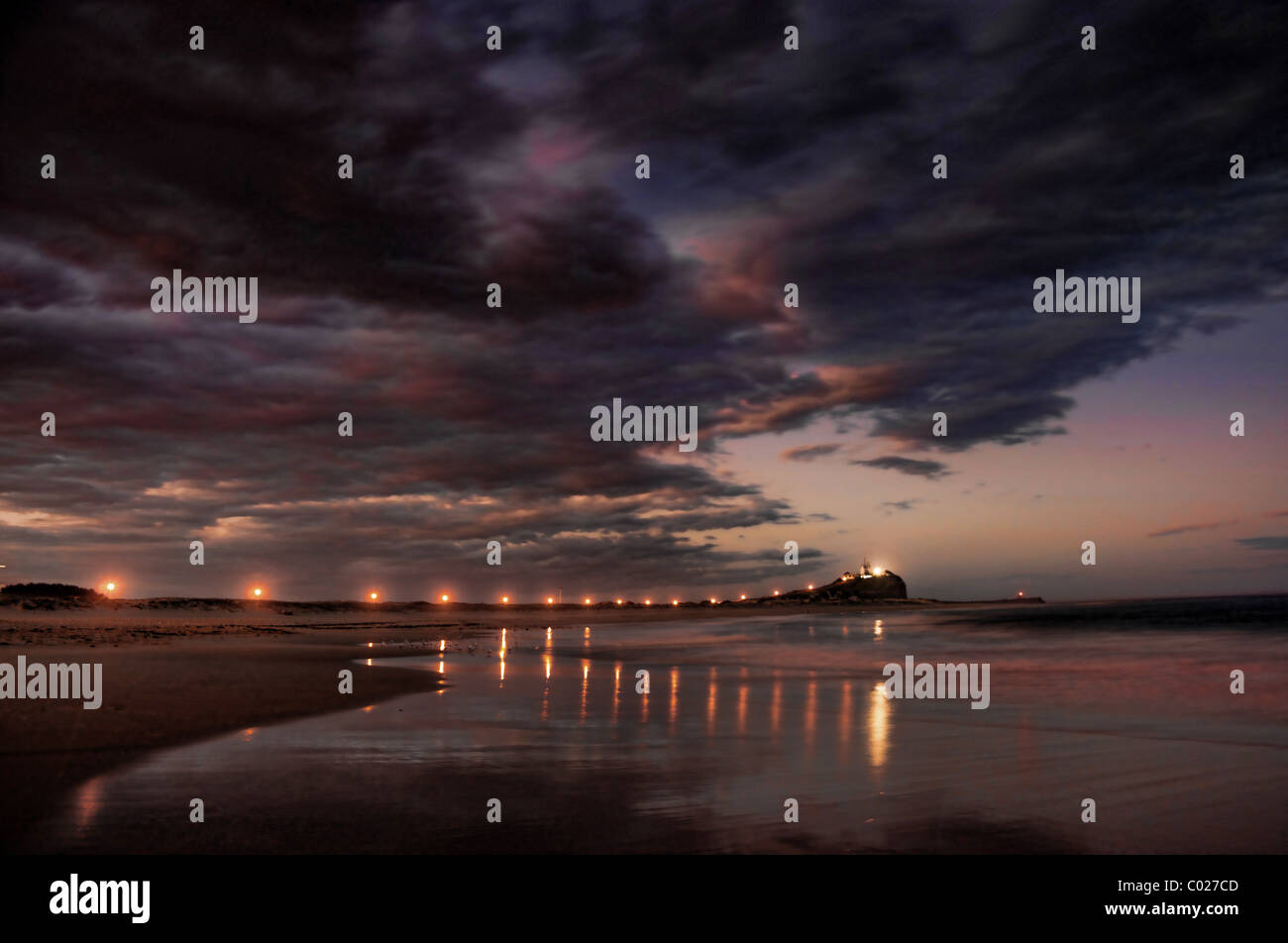 breakwater or jetty leading to lighthouse at night Stock Photo - Alamy