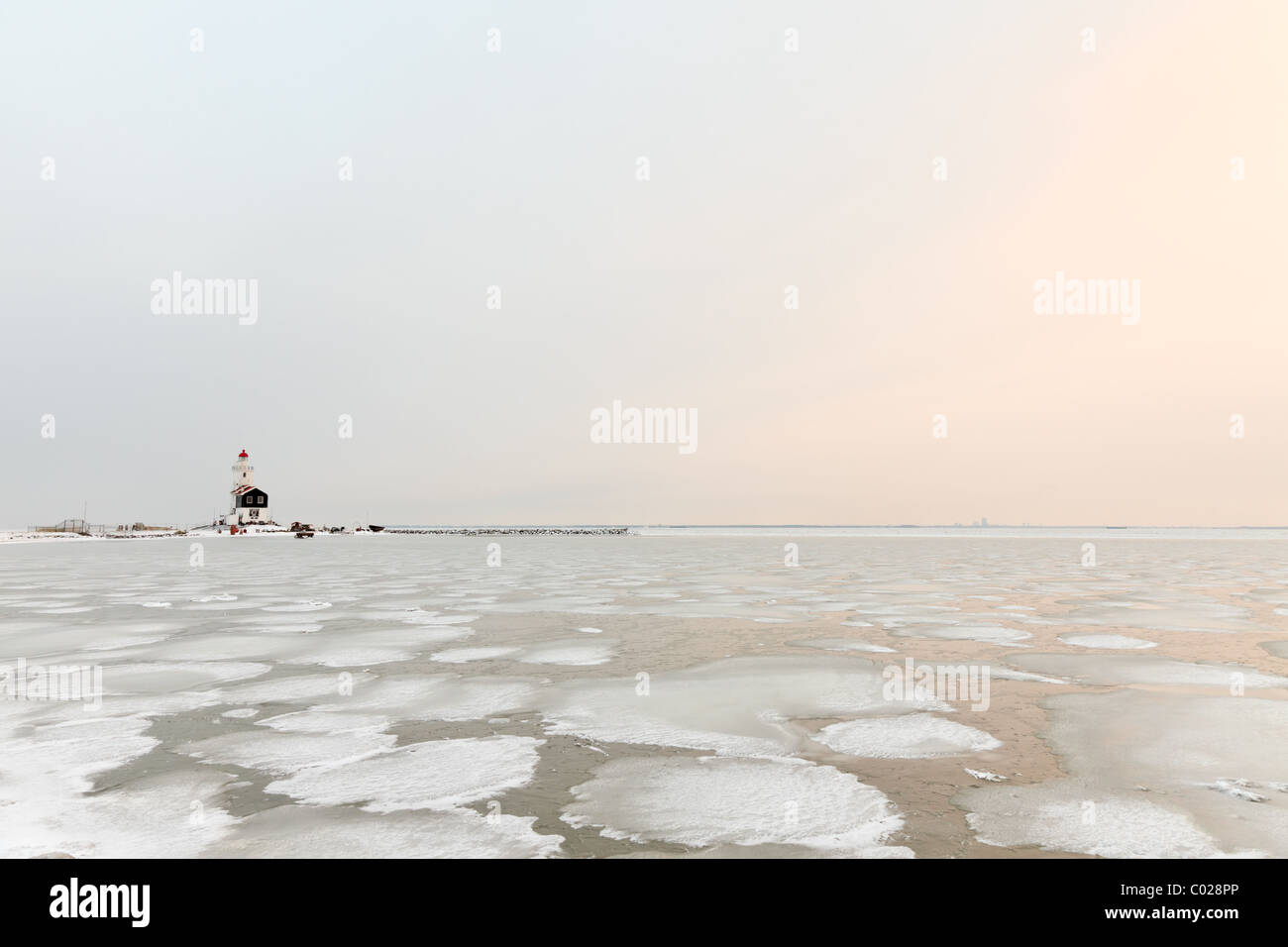 Dutch winter landscape with frozen sea and lighthouse Stock Photo - Alamy