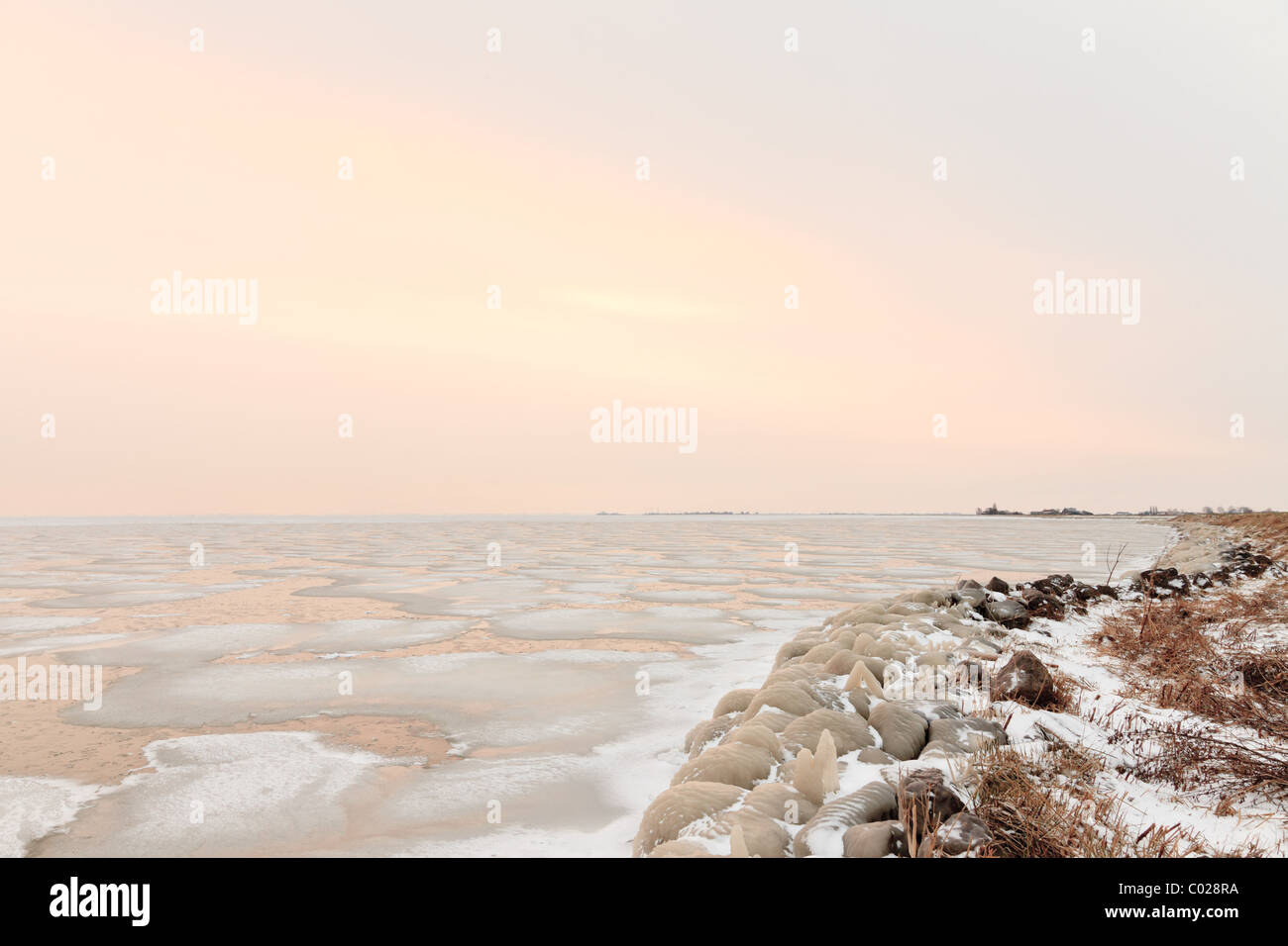 Dutch winter landscape with frozen sea Stock Photo - Alamy