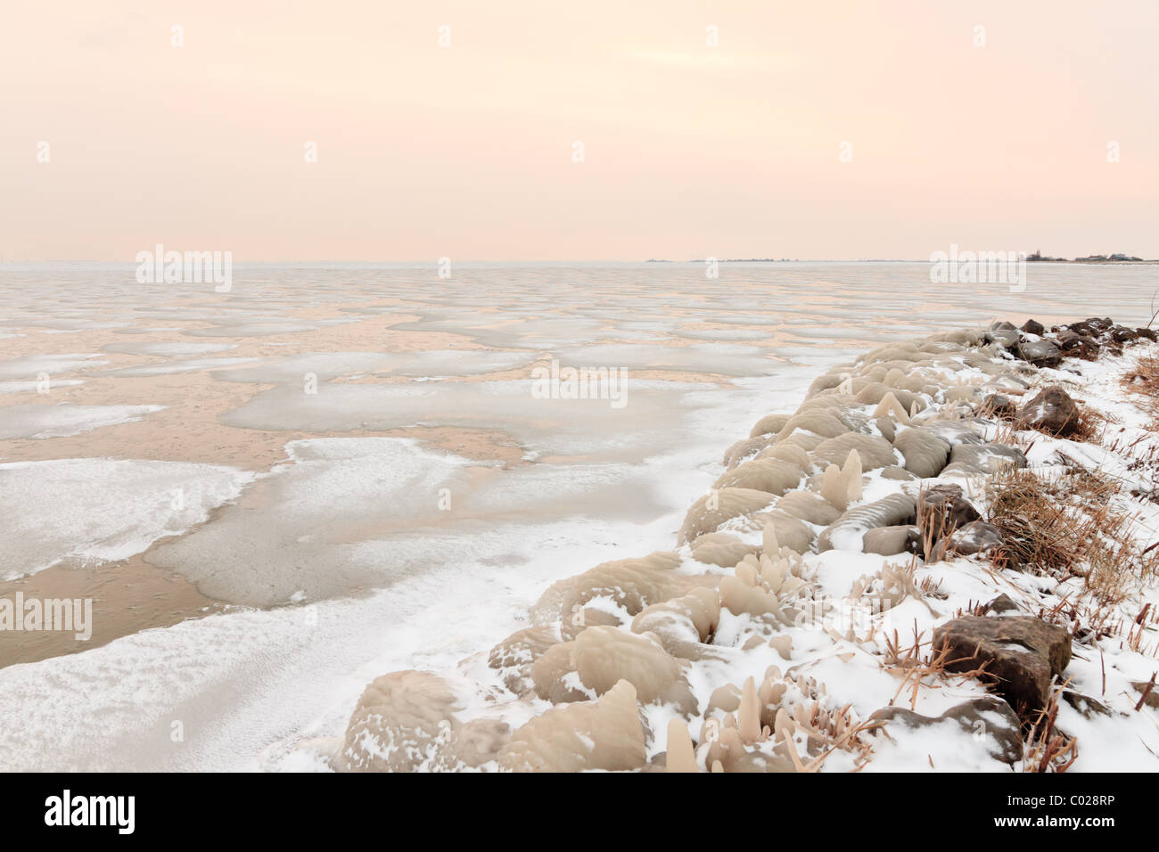 Dutch winter landscape with frozen sea Stock Photo - Alamy