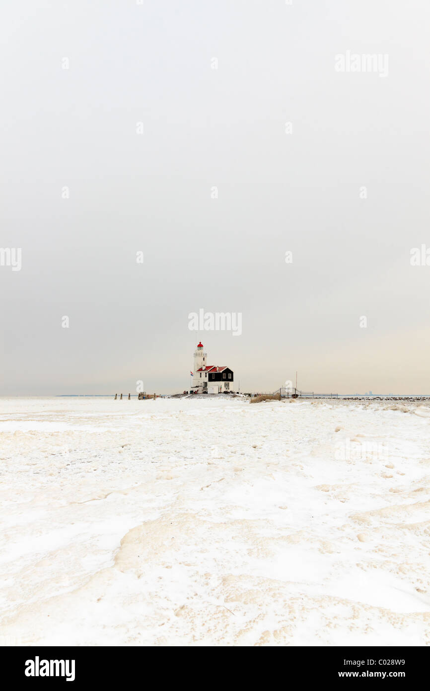 Dutch winter landscape with frozen sea and lighthouse Stock Photo - Alamy