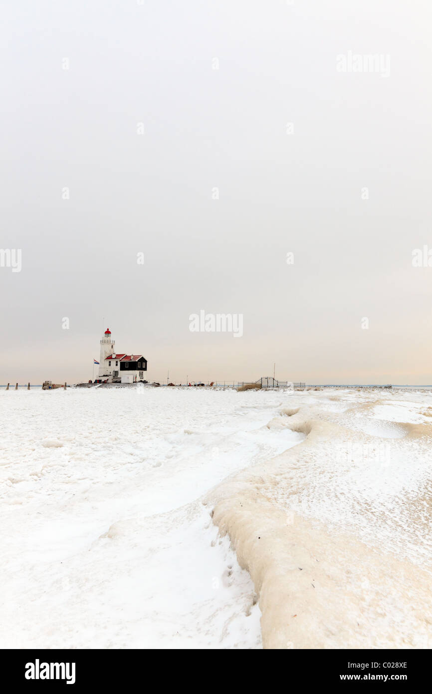 Dutch winter landscape with frozen sea and lighthouse Stock Photo - Alamy
