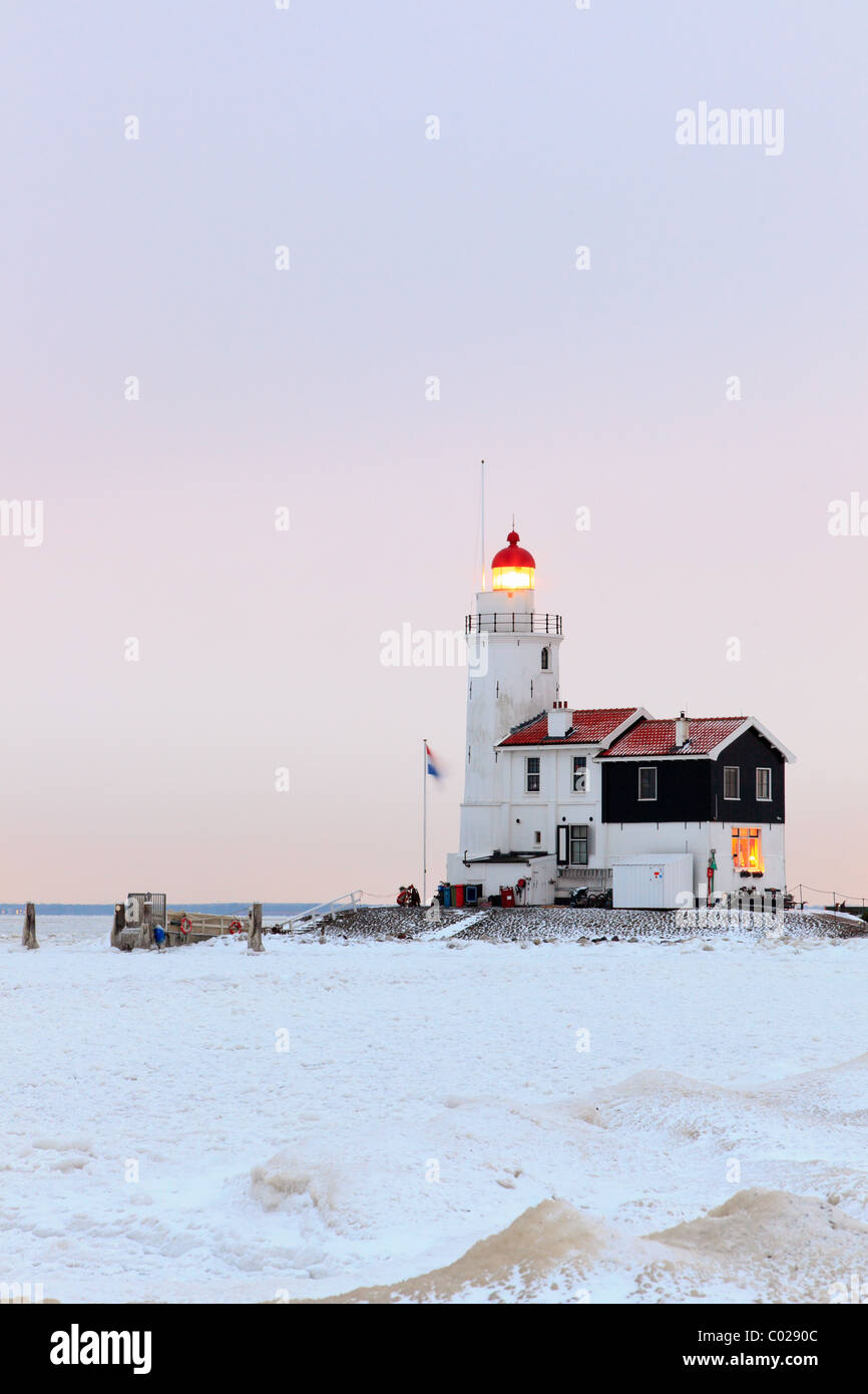 Dutch winter landscape with frozen sea and lighthouse Stock Photo - Alamy