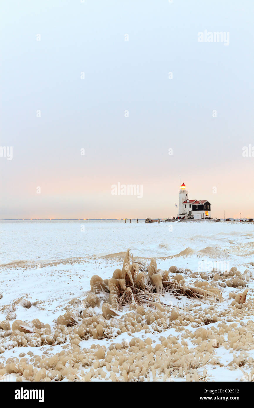 Dutch winter landscape with frozen sea and lighthouse Stock Photo - Alamy