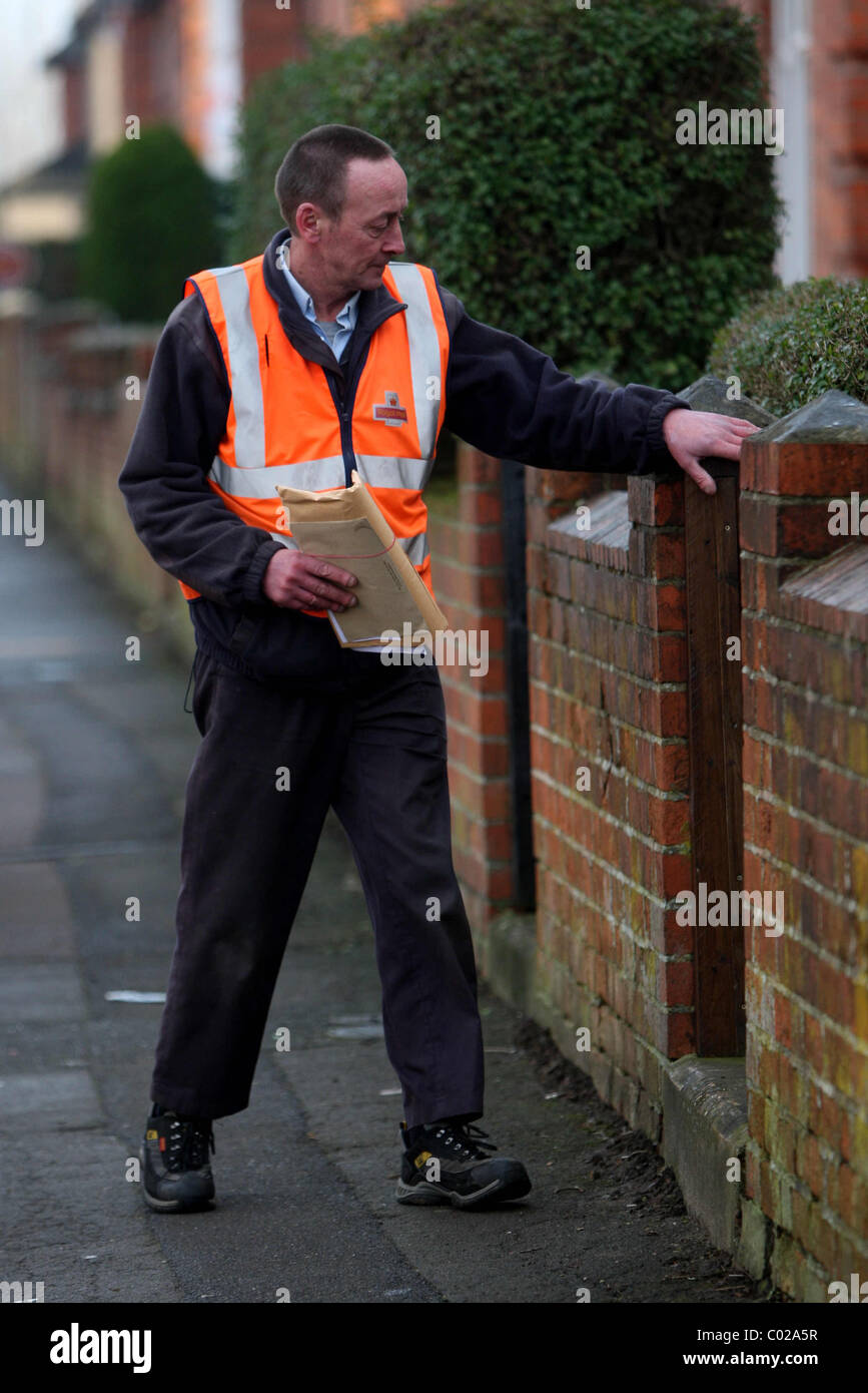 POSTMAN DELIVERING LETTERS Stock Photo - Alamy