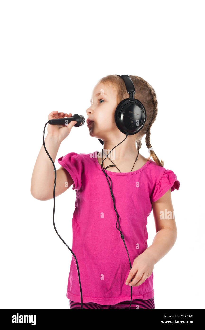 Beautiful girl in headphones with microphone Stock Photo - Alamy