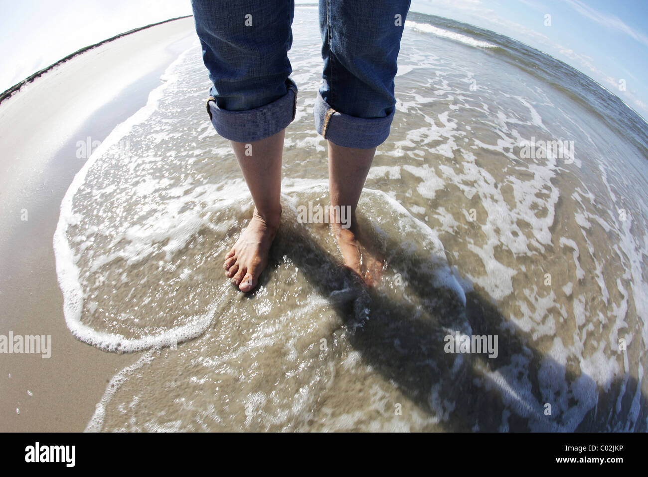 Feet in the sea, beach, Langeoog island, East Frisian Islands, North ...