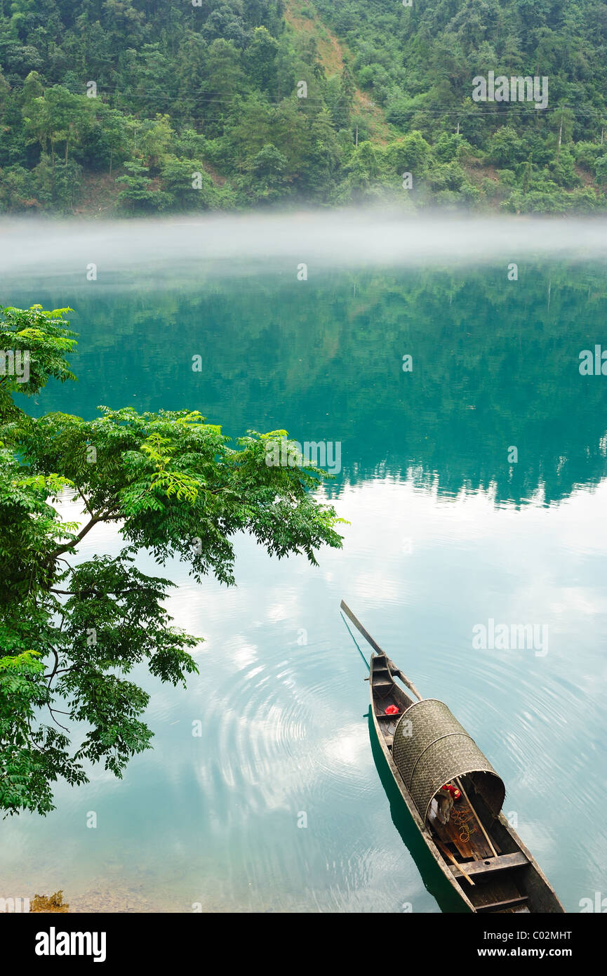 Fishing boat on the foggy river, photo taken in hunan province of China ...