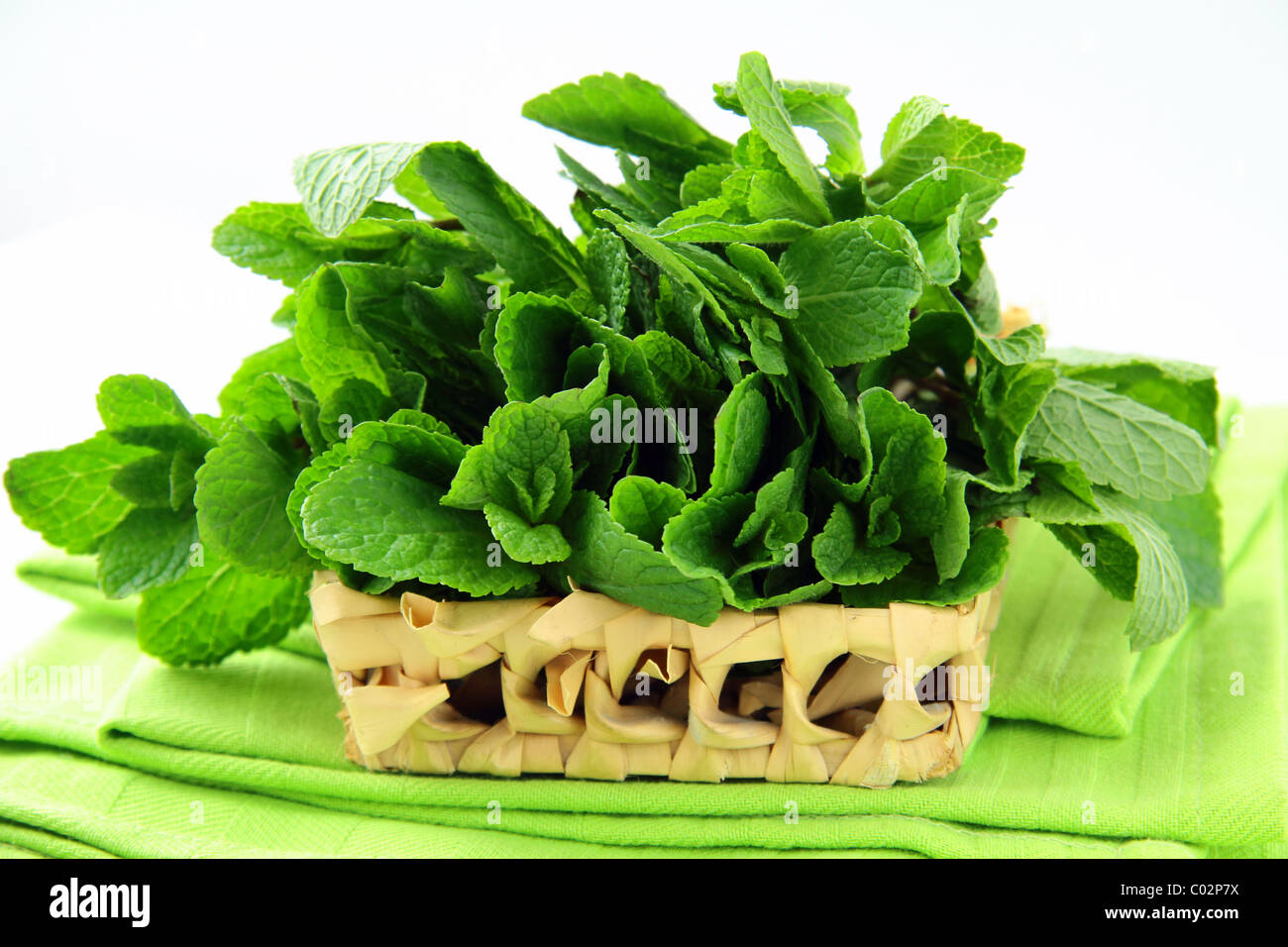 bunch of fresh green mint in a wicker basket Stock Photo - Alamy