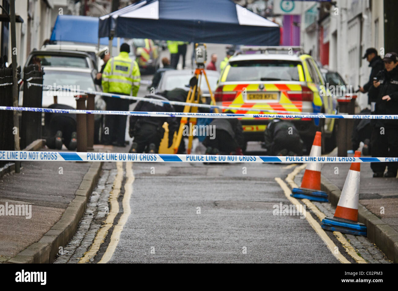 Police investigate the crime scene where police shot dead a suspect ...