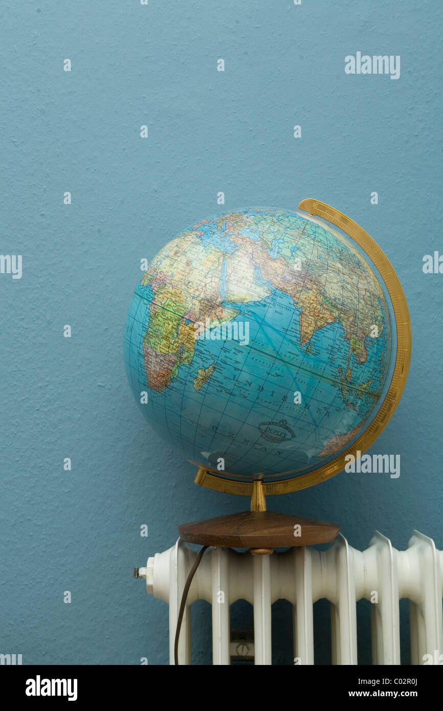 Globe on a radiator, symbolic image for global warming, climate change ...