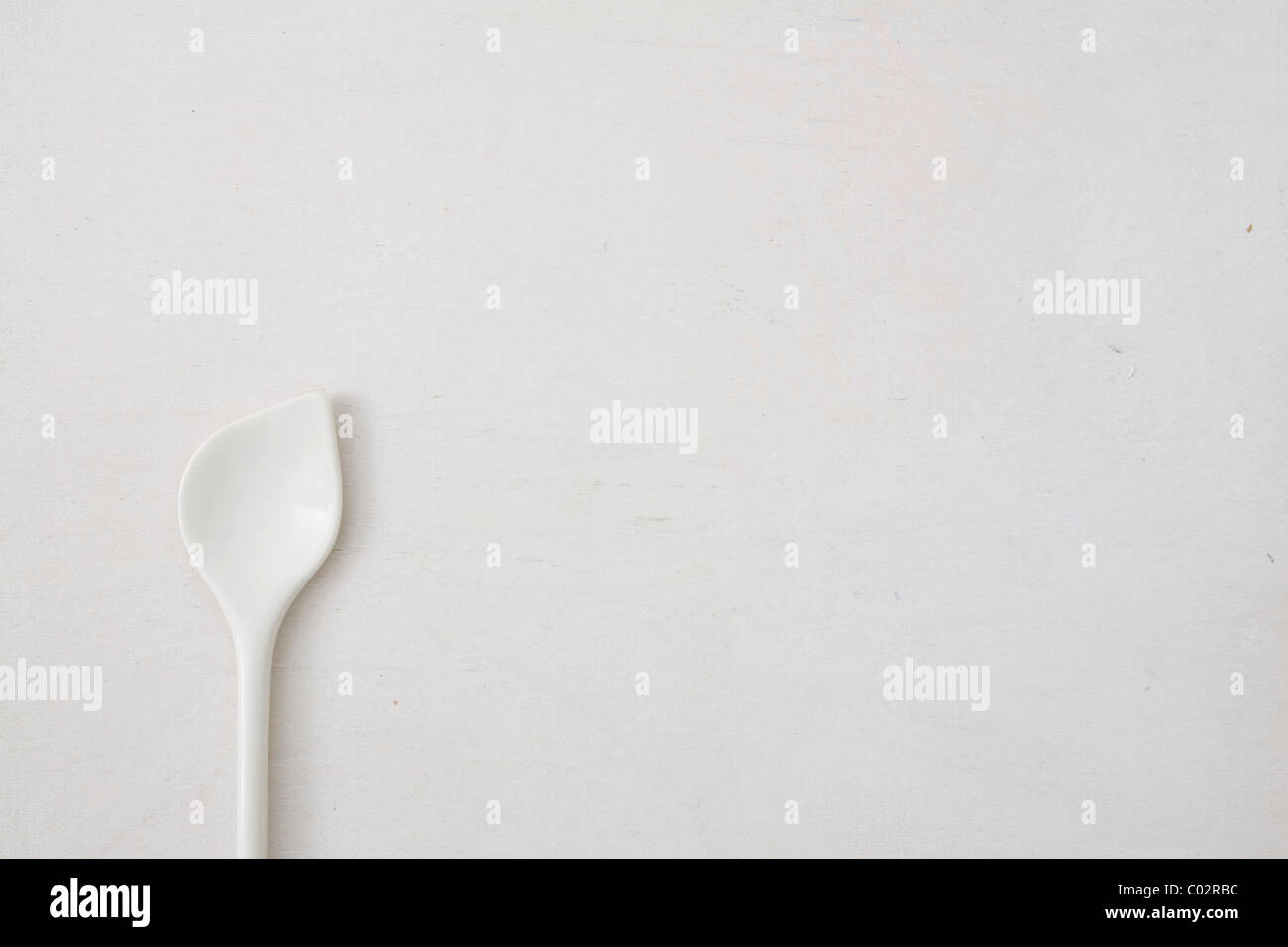 White spoon, detail Stock Photo - Alamy